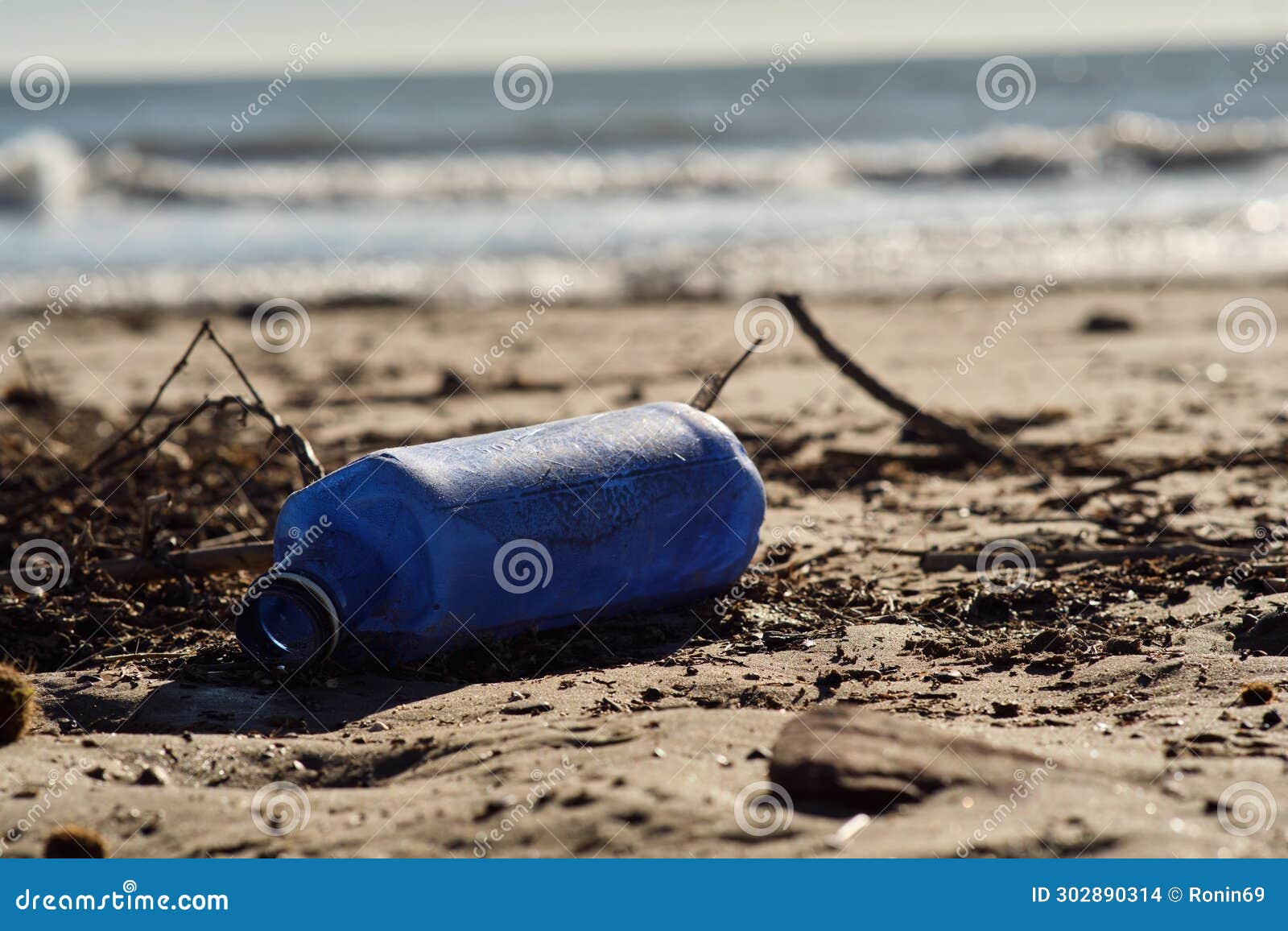 Plastic trash on the beach stock photo. Image of ocean - 302890314