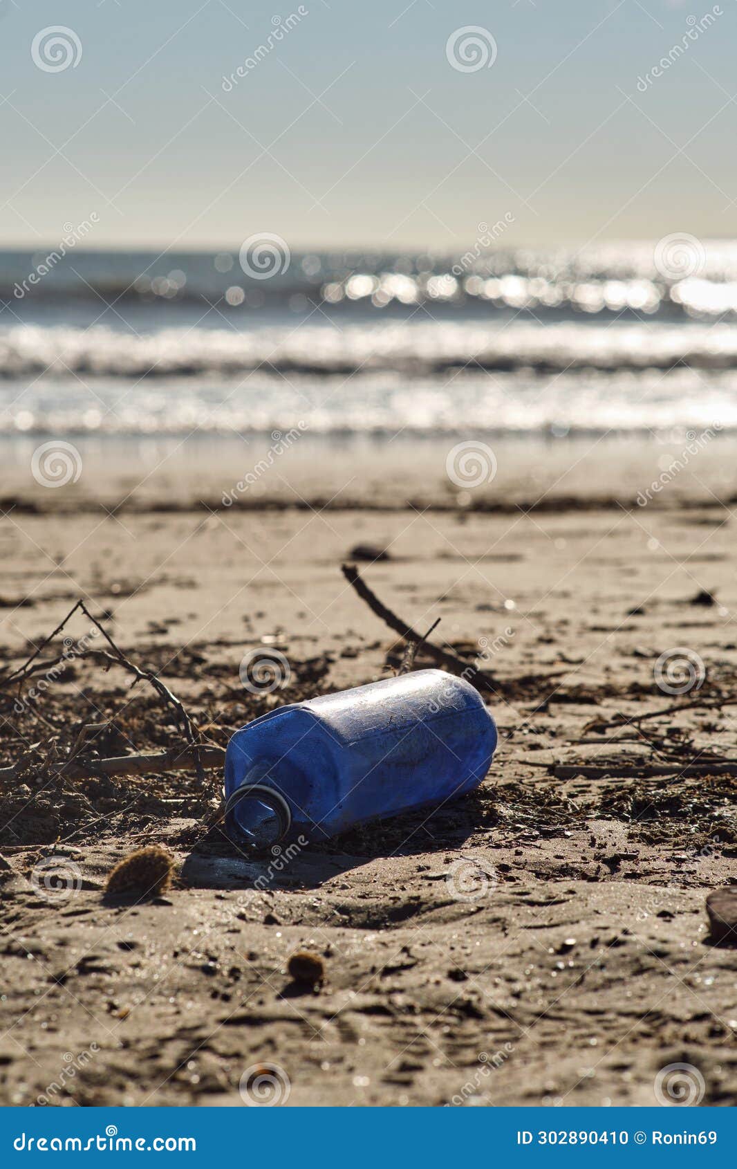 Plastic trash on the beach stock photo. Image of ocean - 302890410