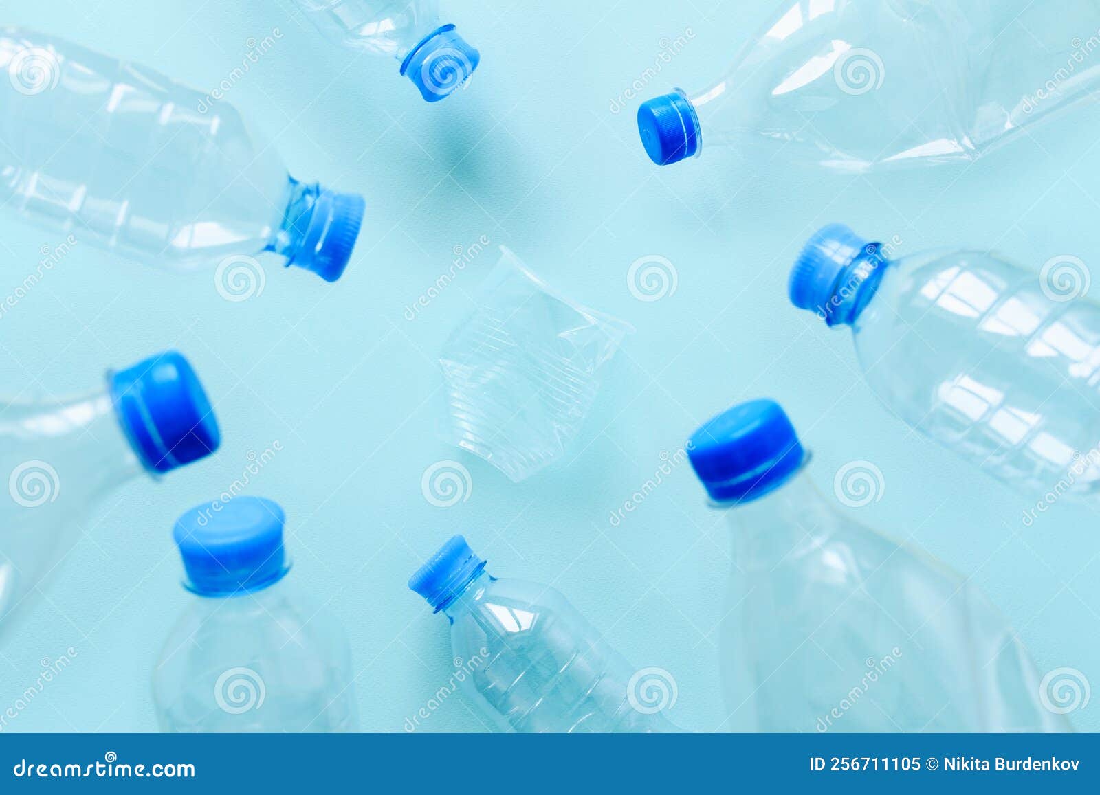 Plastic Trash on a Blue Background. the Concept of Environmental ...