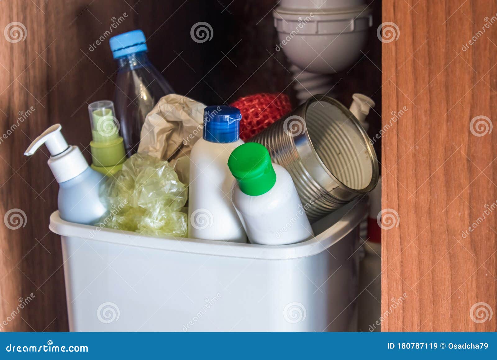 Plastic Trash Can in the Kitchen Cabinet - Bottles, Plastic and Metal ...