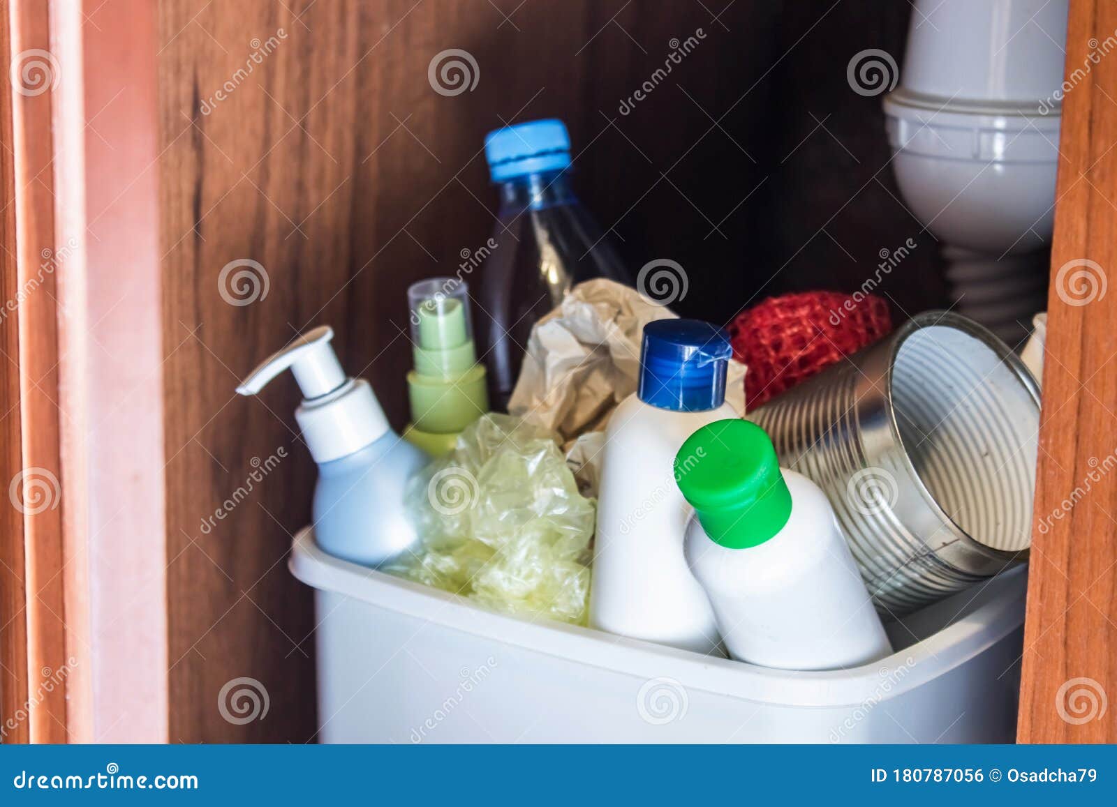 Plastic Trash Can in the Kitchen Cabinet - Bottles, Plastic and Metal ...