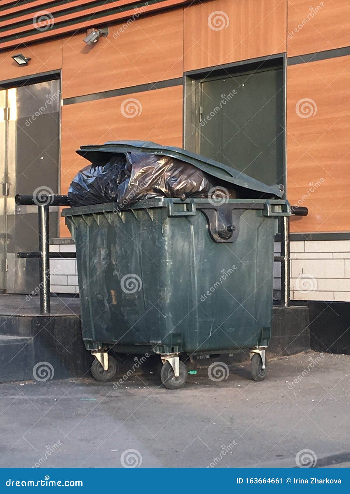 Plastic Trash Can with Waste on the Street. Garbage Can Stock Image ...