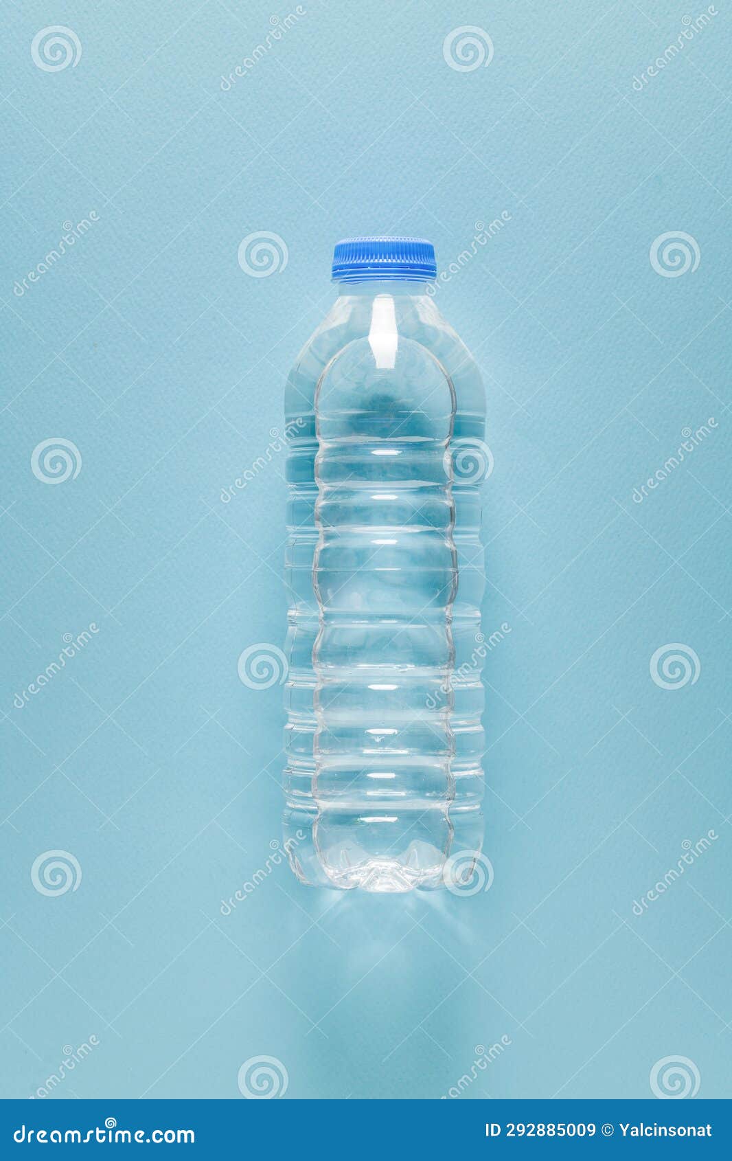 Plastic Water Bottle with Blue Cap on Blue Isolated Background Stock ...
