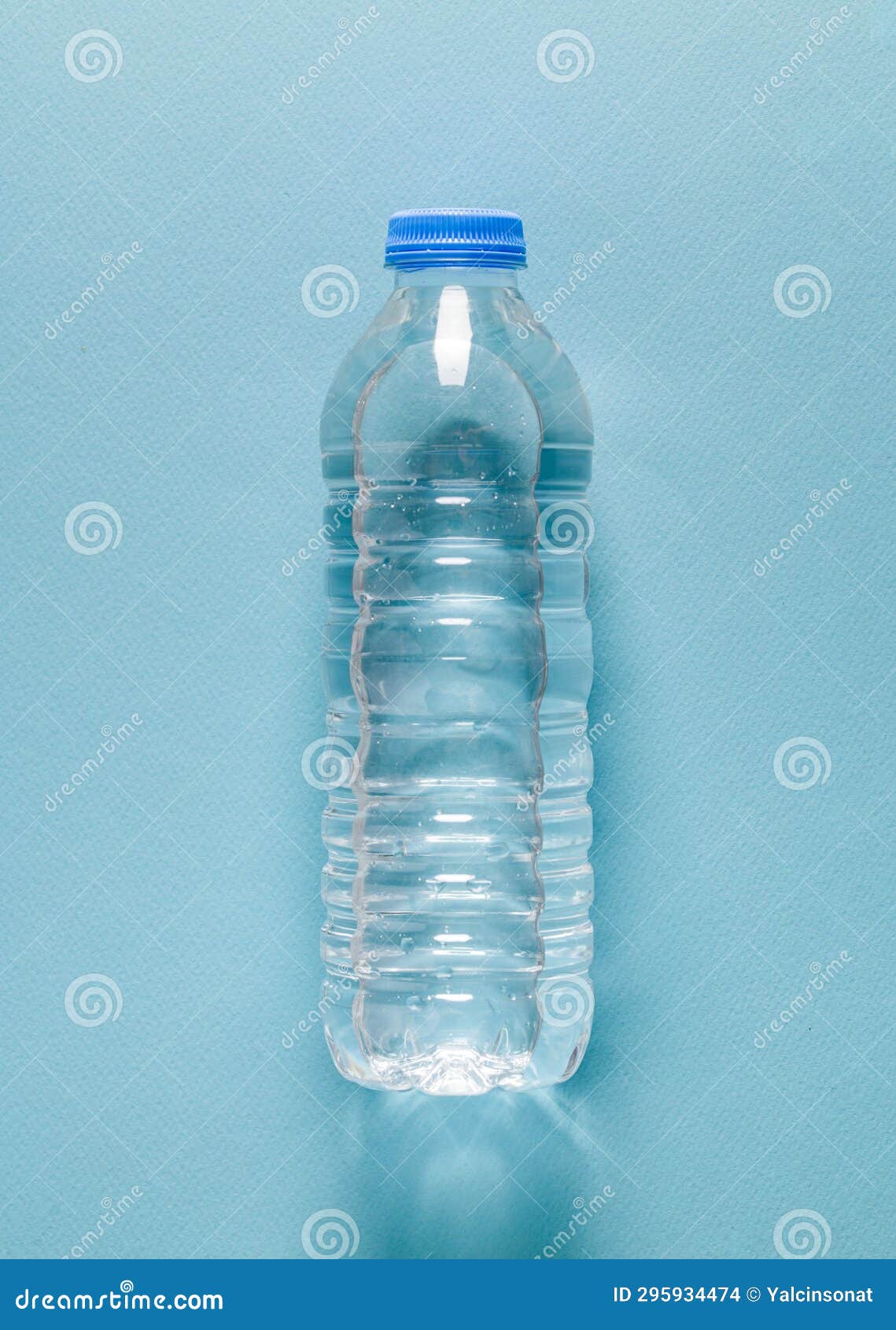 Plastic Water Bottle on Blue Isolated Background Stock Photo - Image of ...