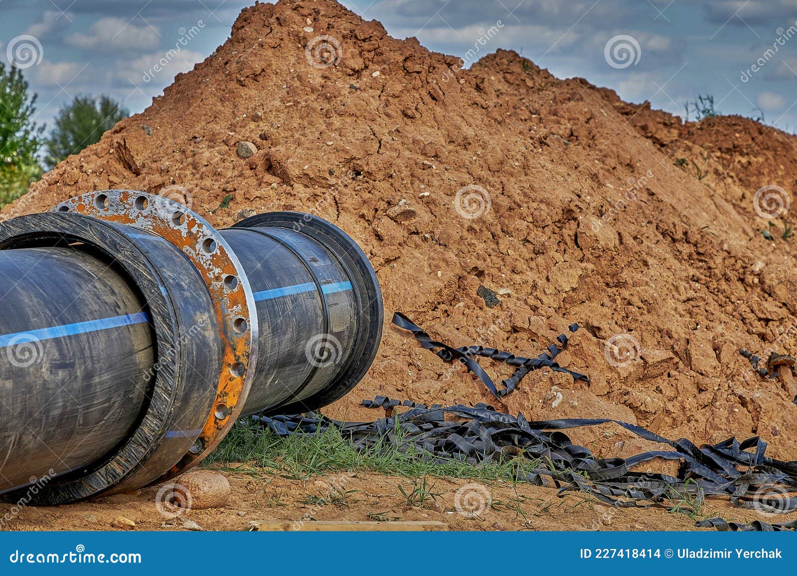 A Plastic Water Pipe is Lying on the Grass.Installation of the Water ...