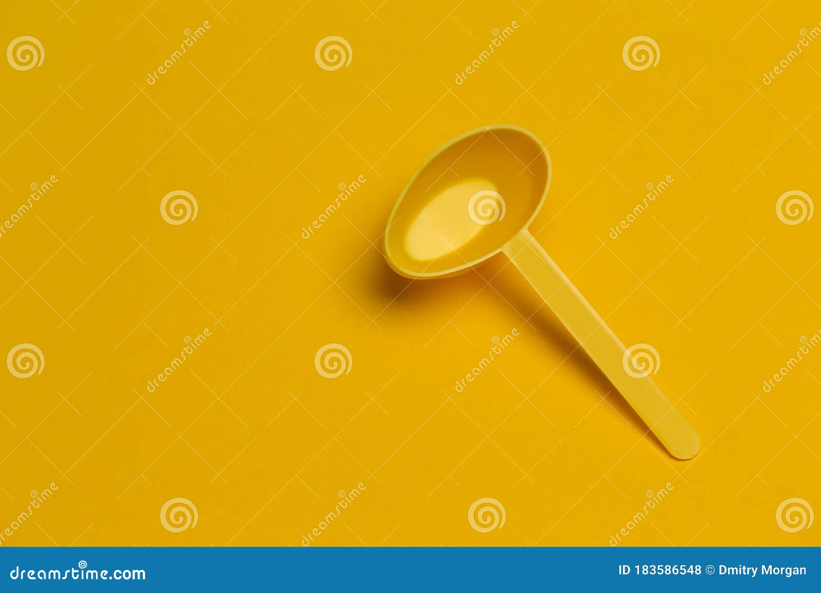 Plastic Yellow Spoon Over Yellow Background Stock Photo - Image of ...