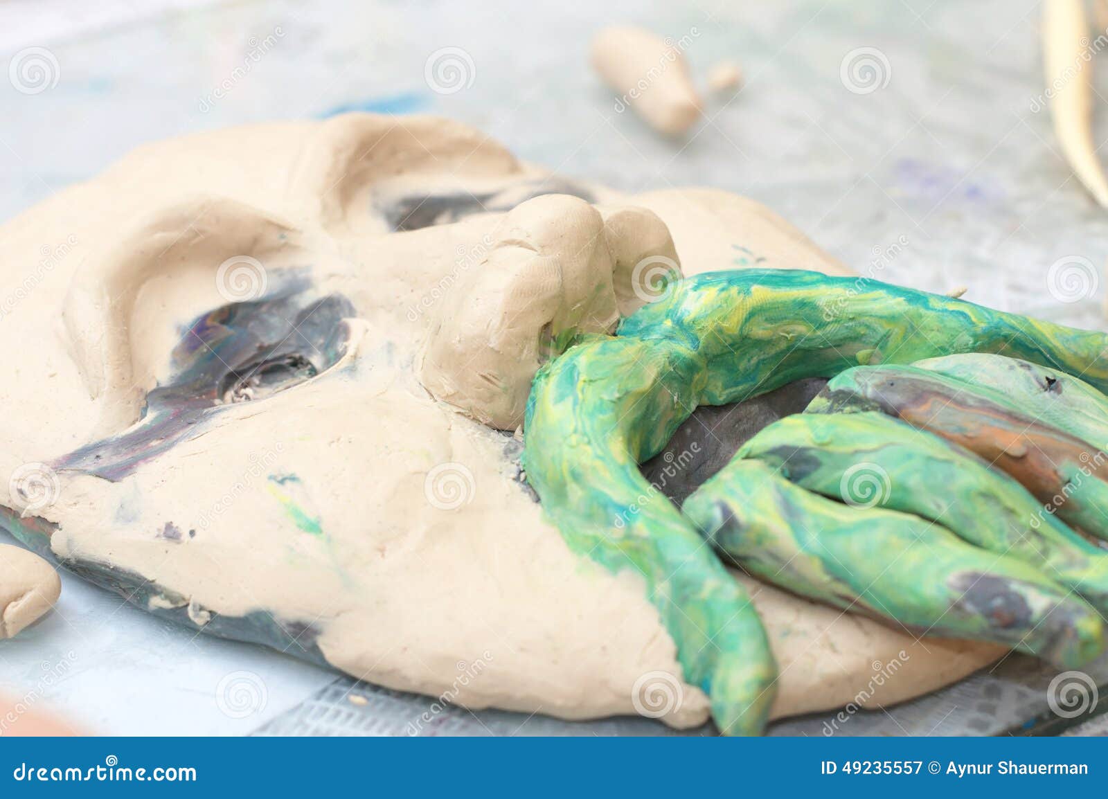 Plasticine face sculpture stock image. Image of work - 49235557
