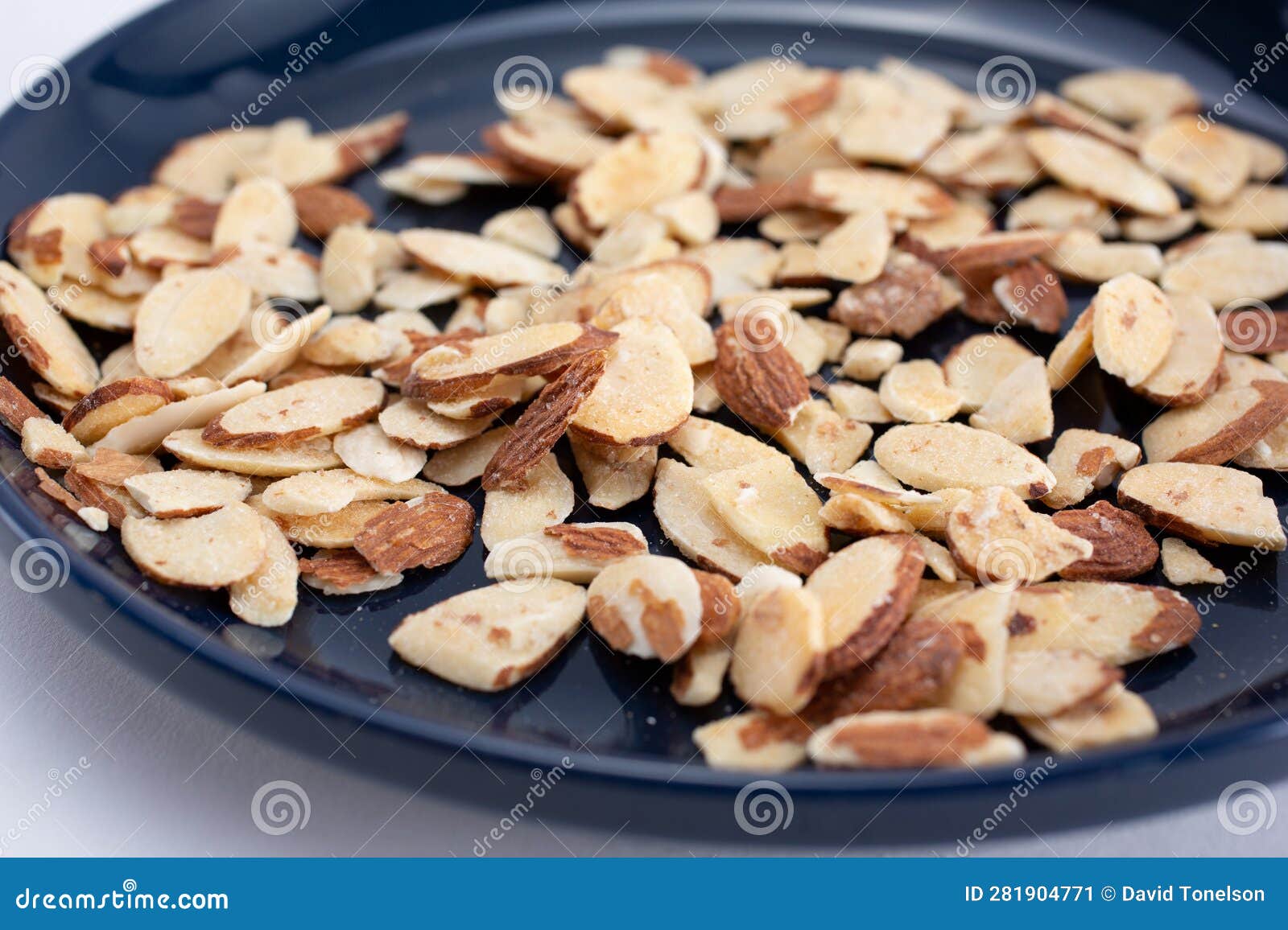Plate of almond slices stock image. Image of organic - 281904771