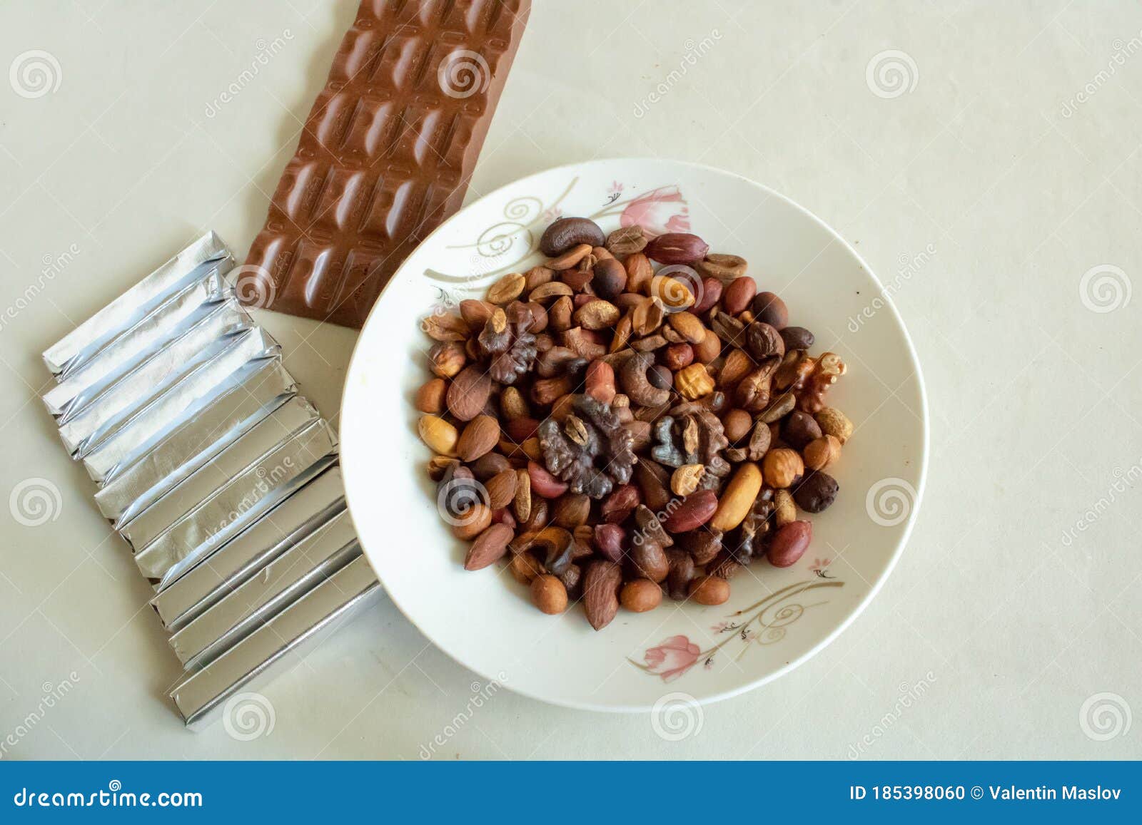 Plate with Assorted Nuts on a White Background Stock Photo - Image of ...