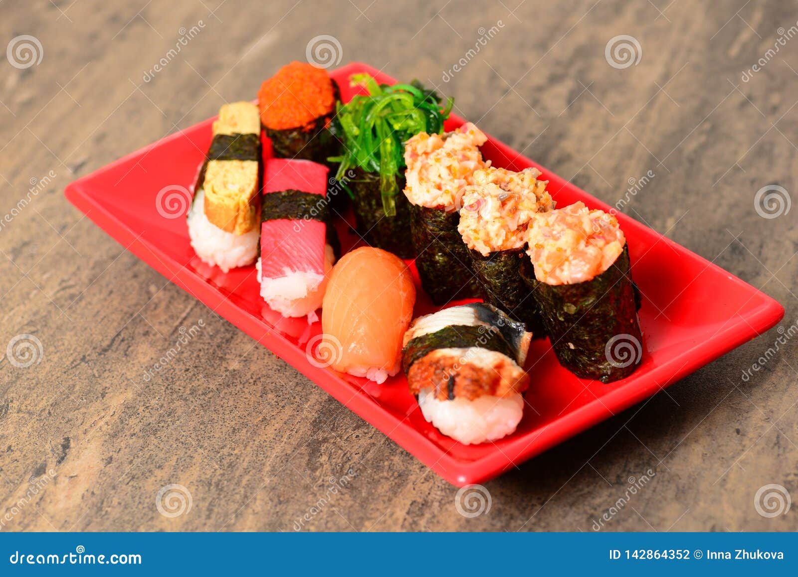 Plate with assorted sushi stock photo. Image of meal - 142864352