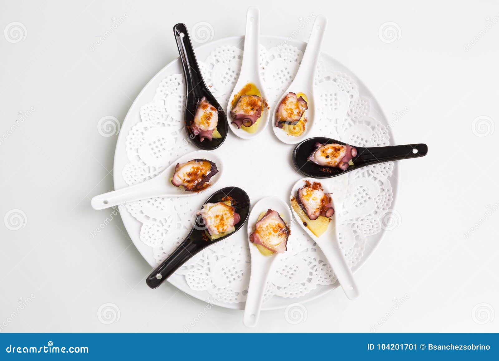 Octopus lid on spoon stock image. Image of appetizer - 104201701