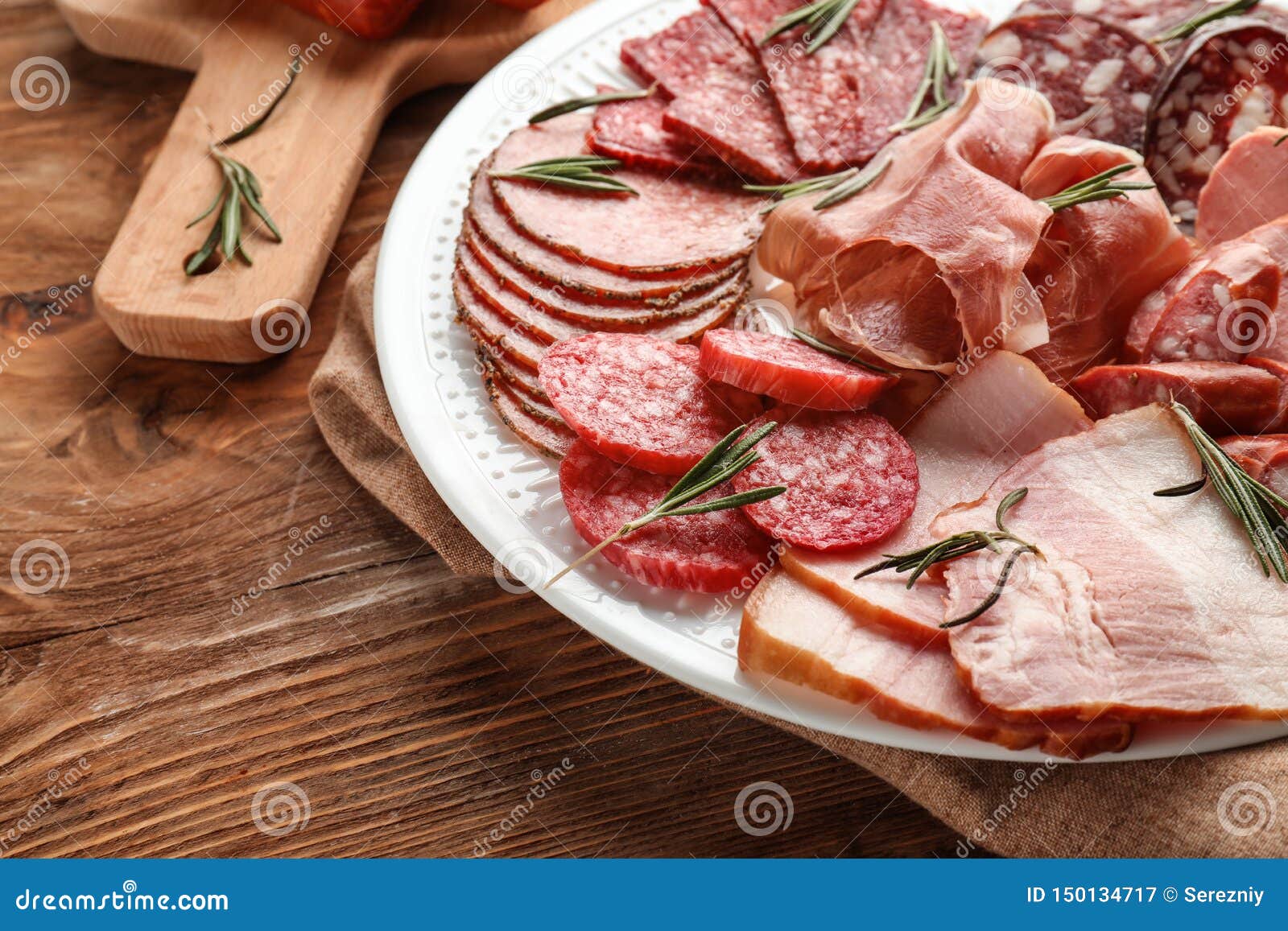 Plate with Assortment of Delicious Deli Meats on Table Stock Image ...