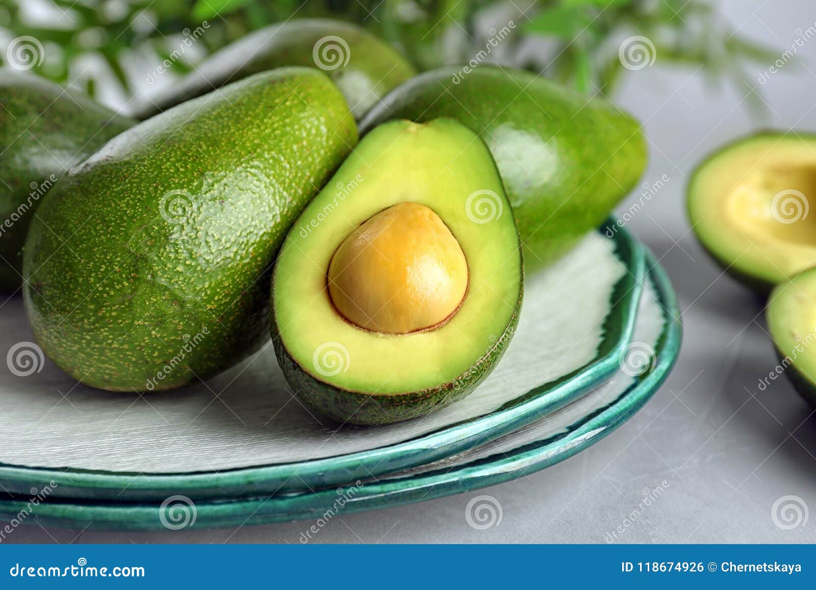 Plate with Avocados on Grey Table Stock Photo - Image of core, gourmet ...