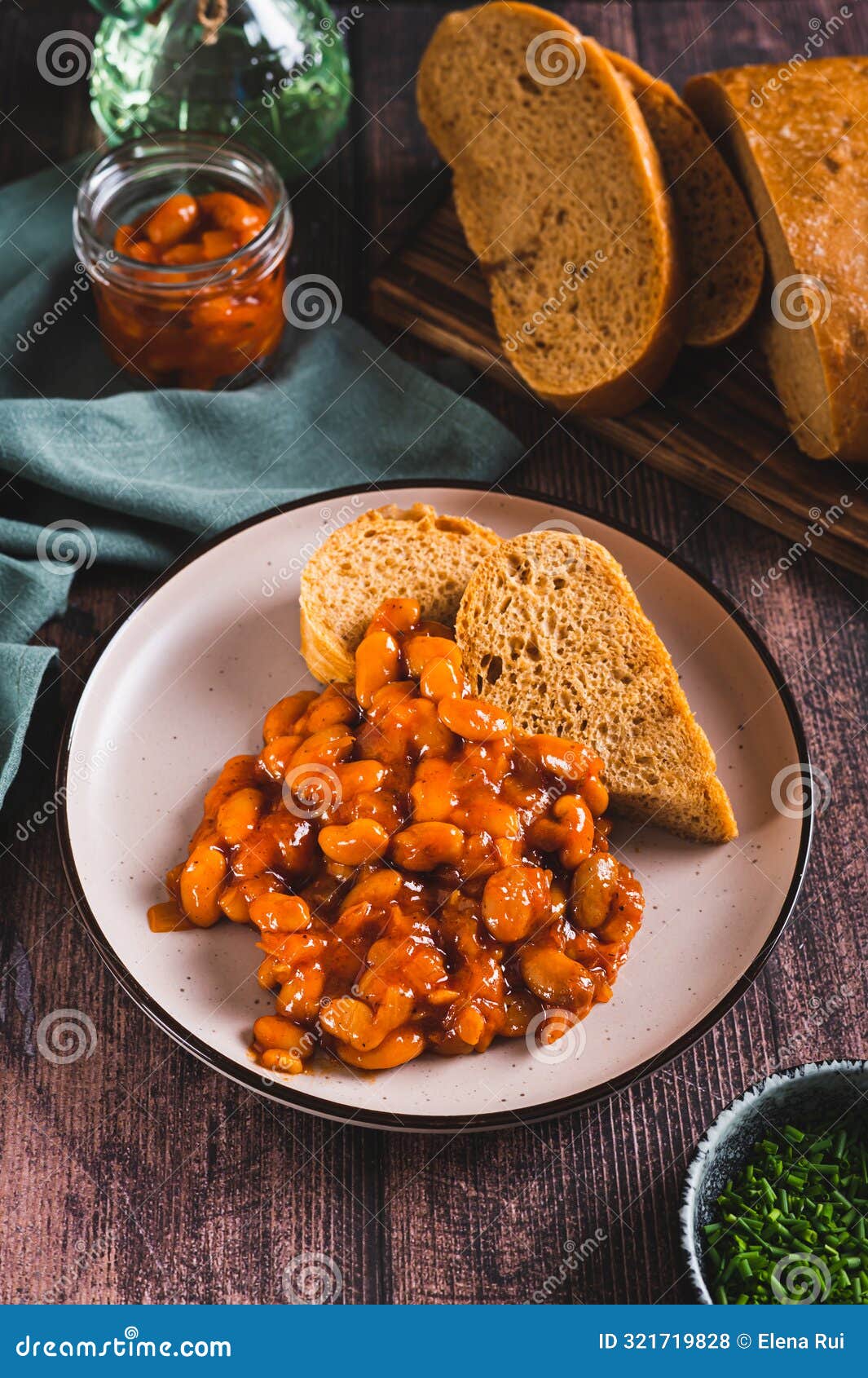 Plate with Baked Beans in Tomato Sauce and Rye Bread on the Table ...