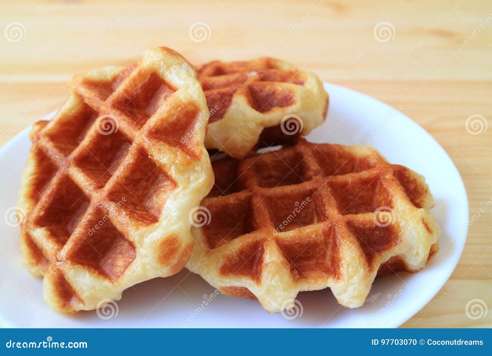 Plate of Belgian Waffles on White Plate Served on Wooden Table Stock ...