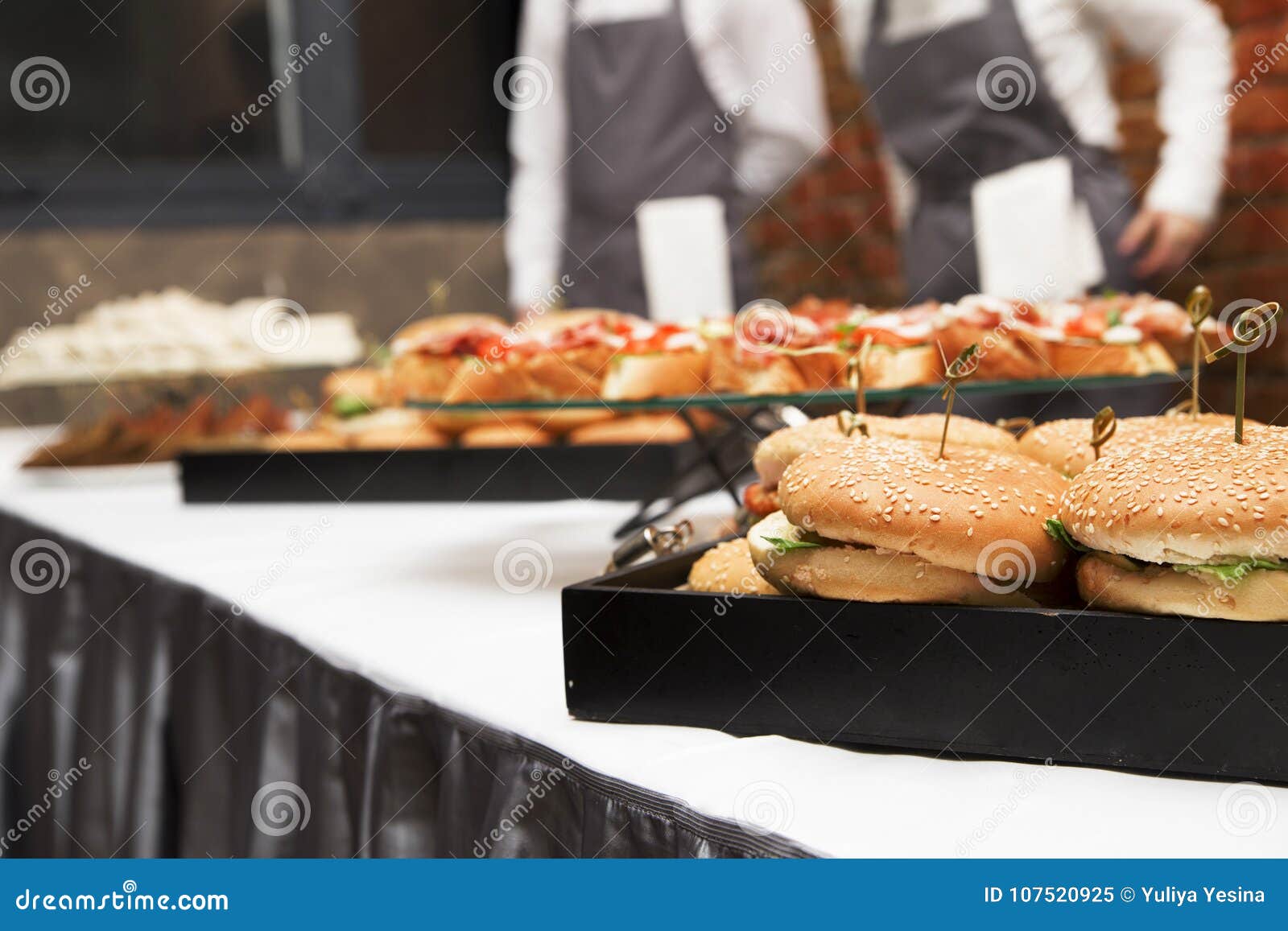 A Plate of Burgers on a Buffet Table Stock Image - Image of buffet ...