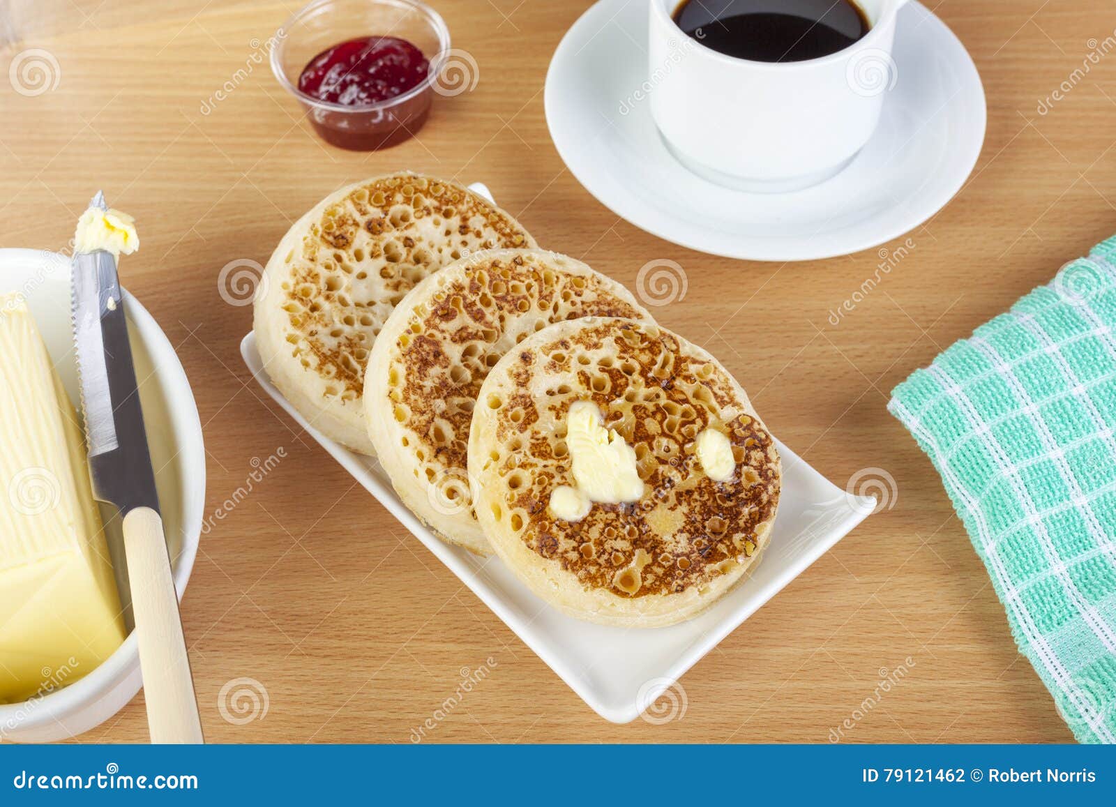 Plate of Butter Drenched Crumpets and Black Coffee Stock Photo - Image ...