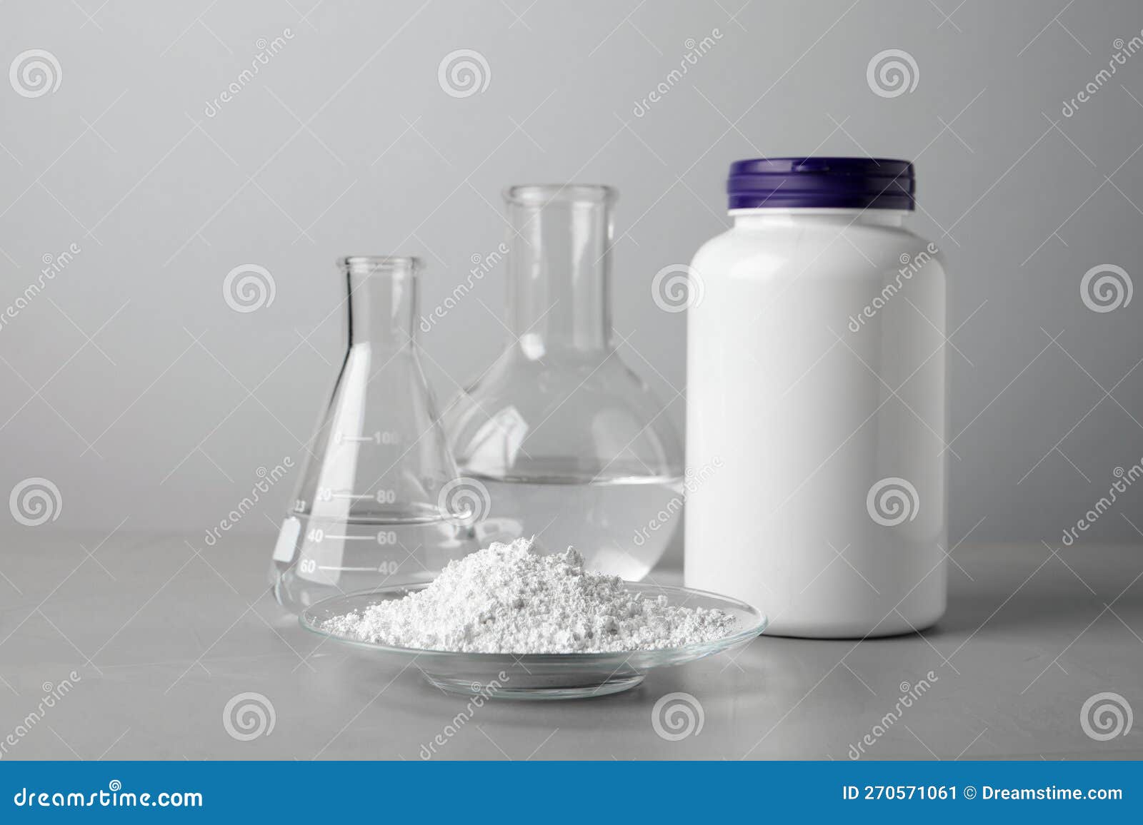 Plate with Calcium Carbonate Powder, Jar and Laboratory Glassware on ...