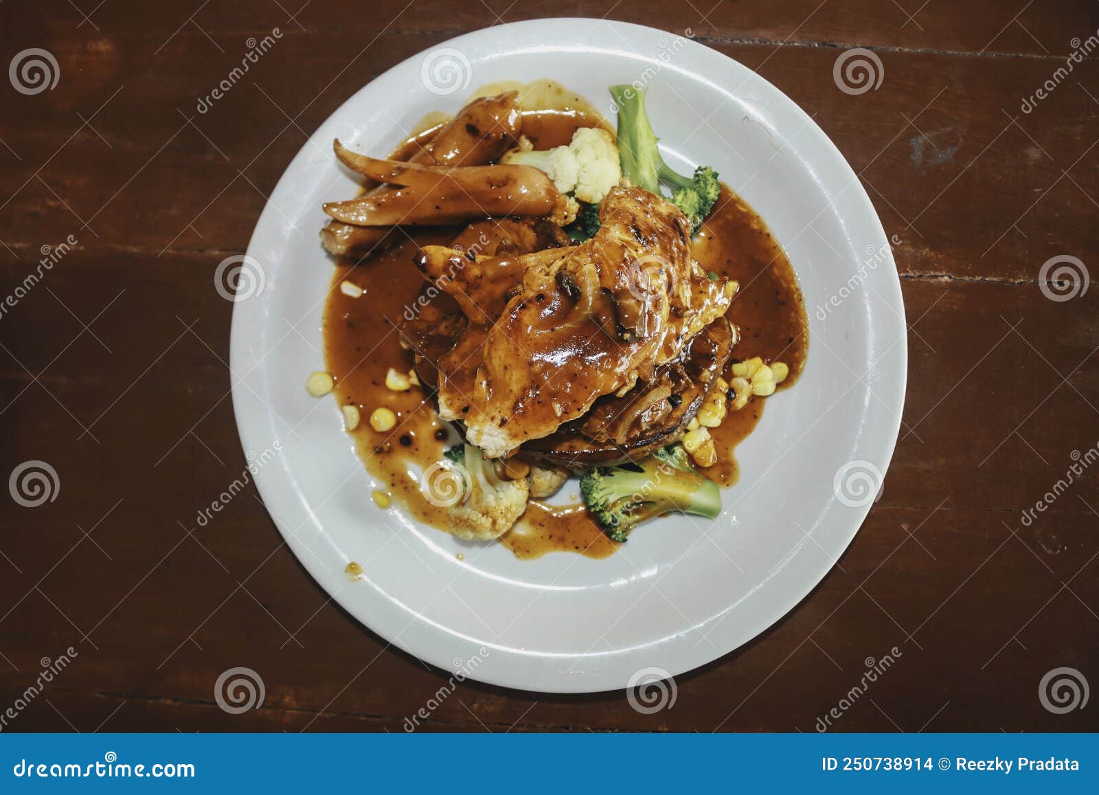 A Plate of Chicken and Beef Steak and Sausages Stock Photo - Image of ...