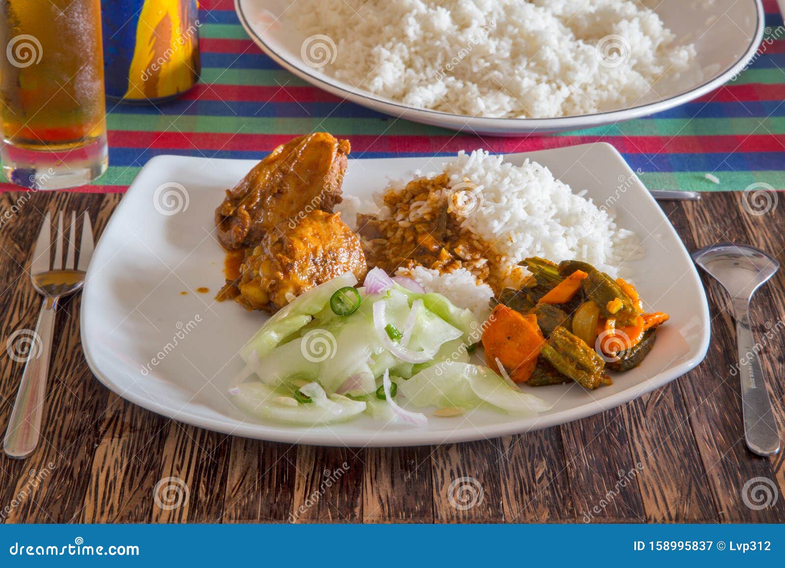 A Plate of Chicken, Rice and Vegetables is on the Table . Stock Image ...