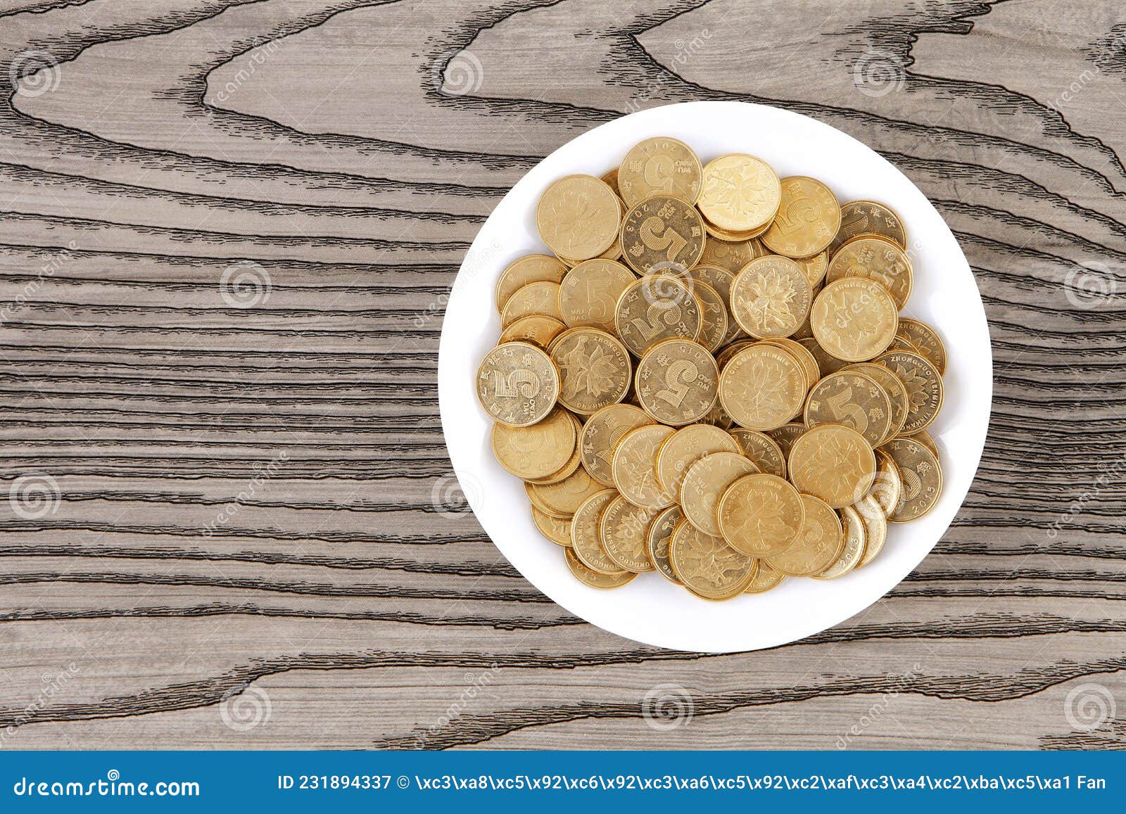 A plate of coins on table stock image. Image of coins - 231894337