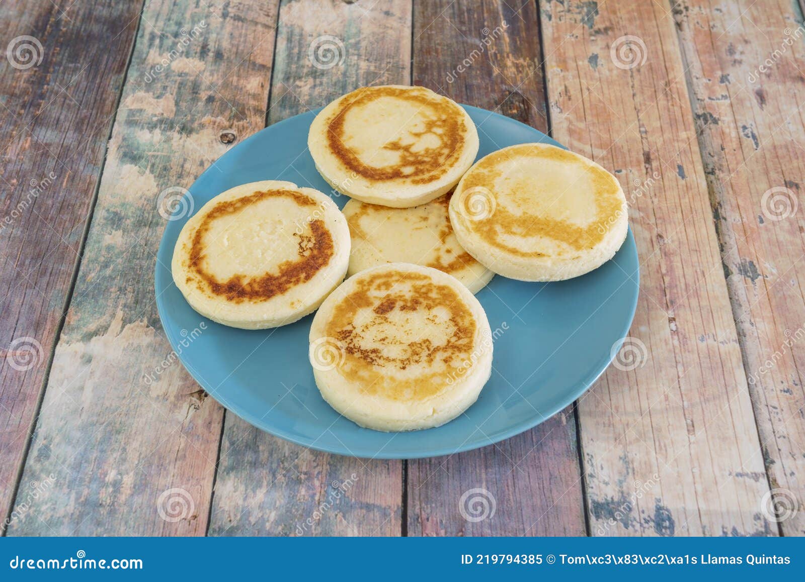 Plate Of Arepas Photographed In Dark Wood With Natural Light. The ...