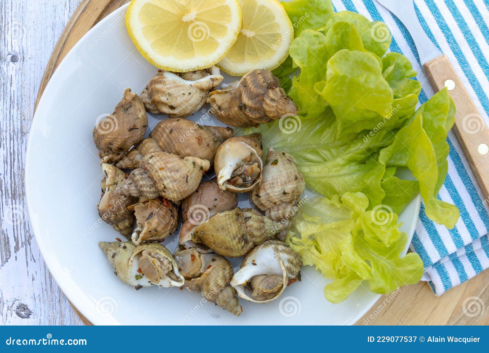 Plate of Cooked Whelks on a Table Stock Image - Image of plate, spices ...