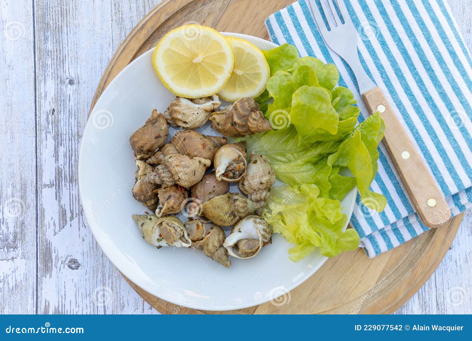 Plate of Cooked Whelks on a Table Stock Photo - Image of whelk, fresh ...
