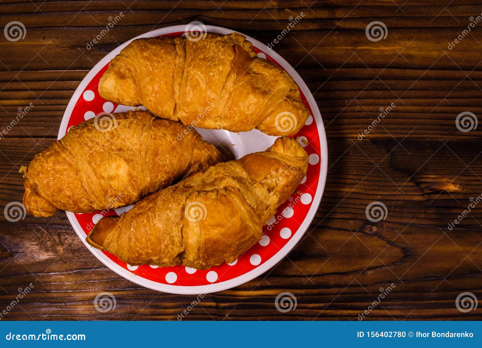Plate with Croissants on a Wooden Table. Top View Stock Photo - Image ...