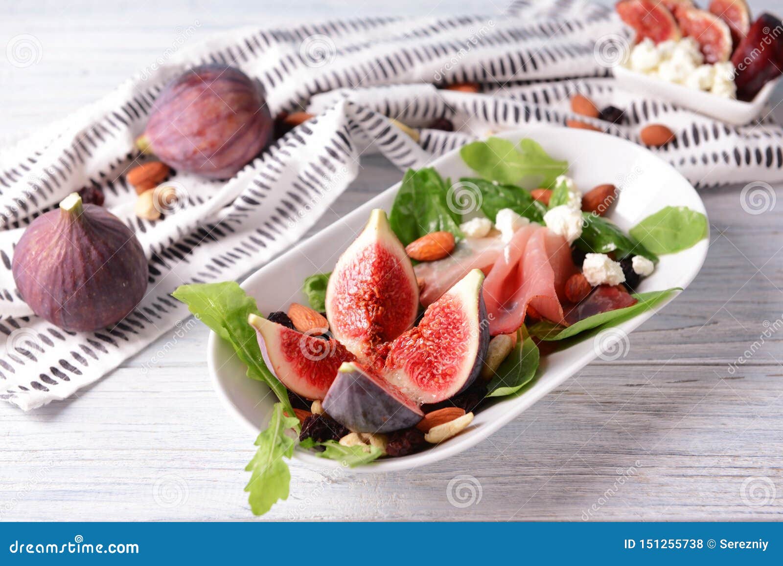 Plate with Delicious Fig Salad on Light Wooden Table Stock Photo ...