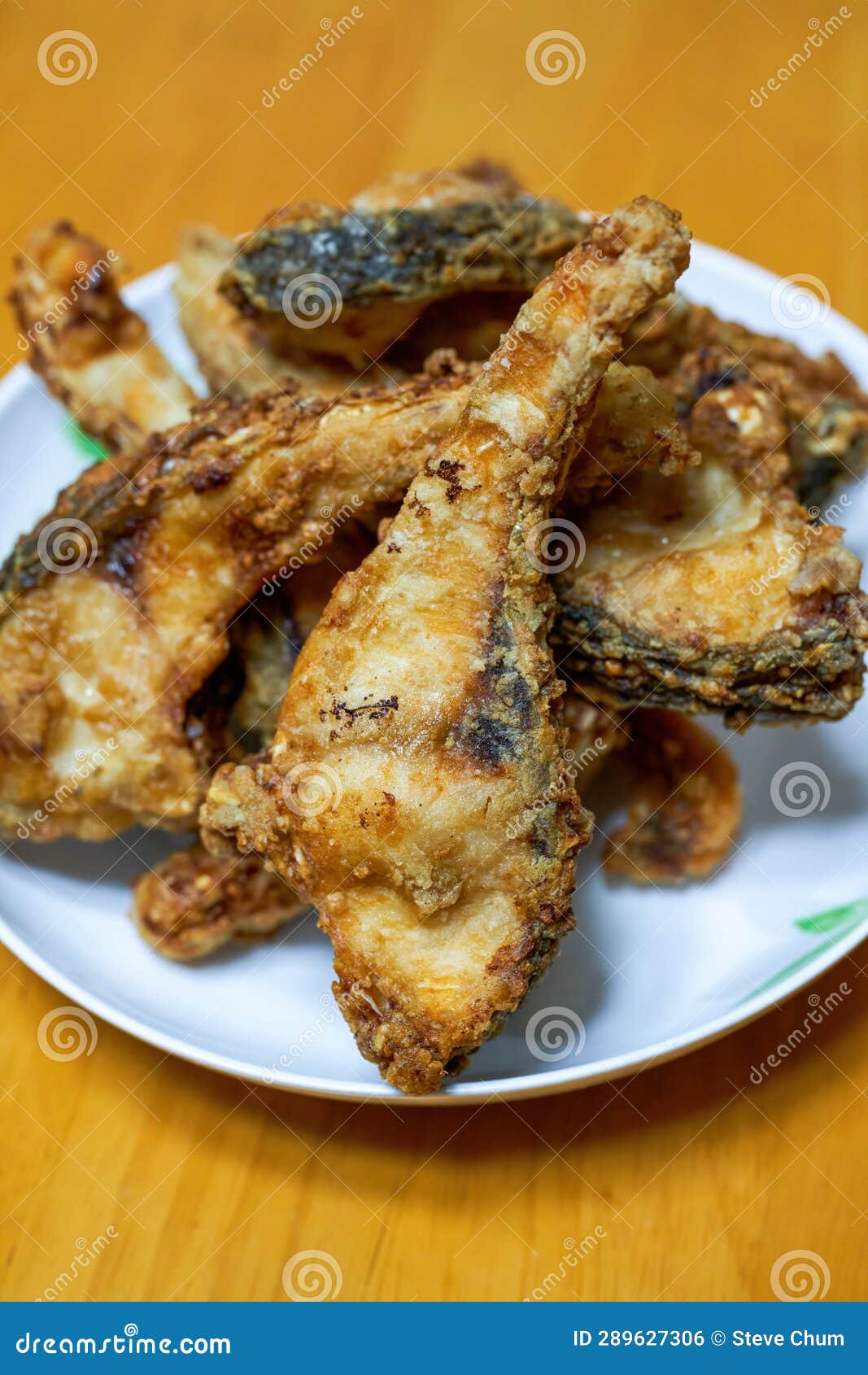 A Plate of Delicious Fried Grass Carp Belly Closeup Stock Photo - Image ...