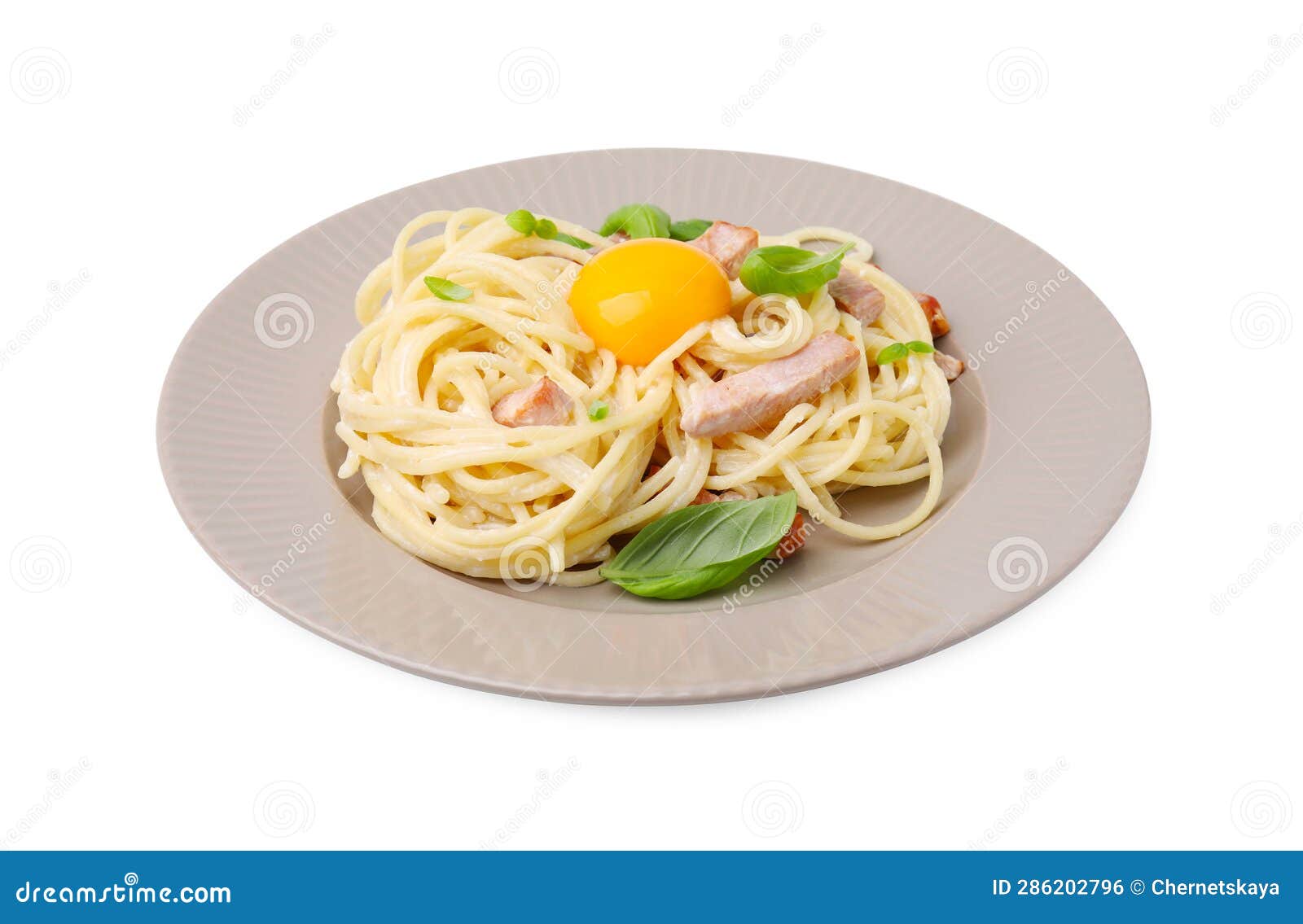 Plate Of Delicious Pasta Carbonara With Egg Yolk Isolated On White