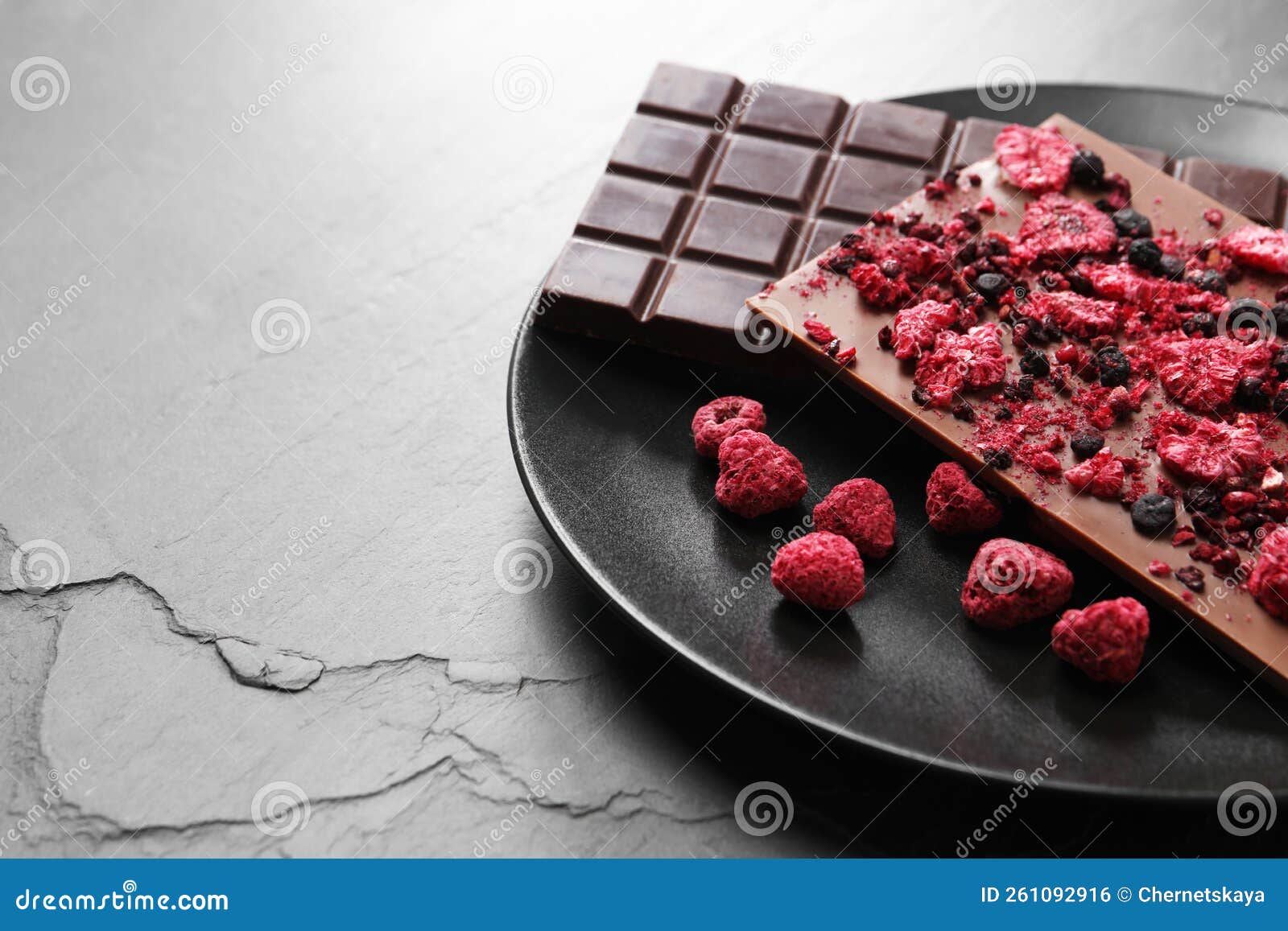 Plate and Different Chocolate Bars with Freeze Dried Fruits on Slate ...