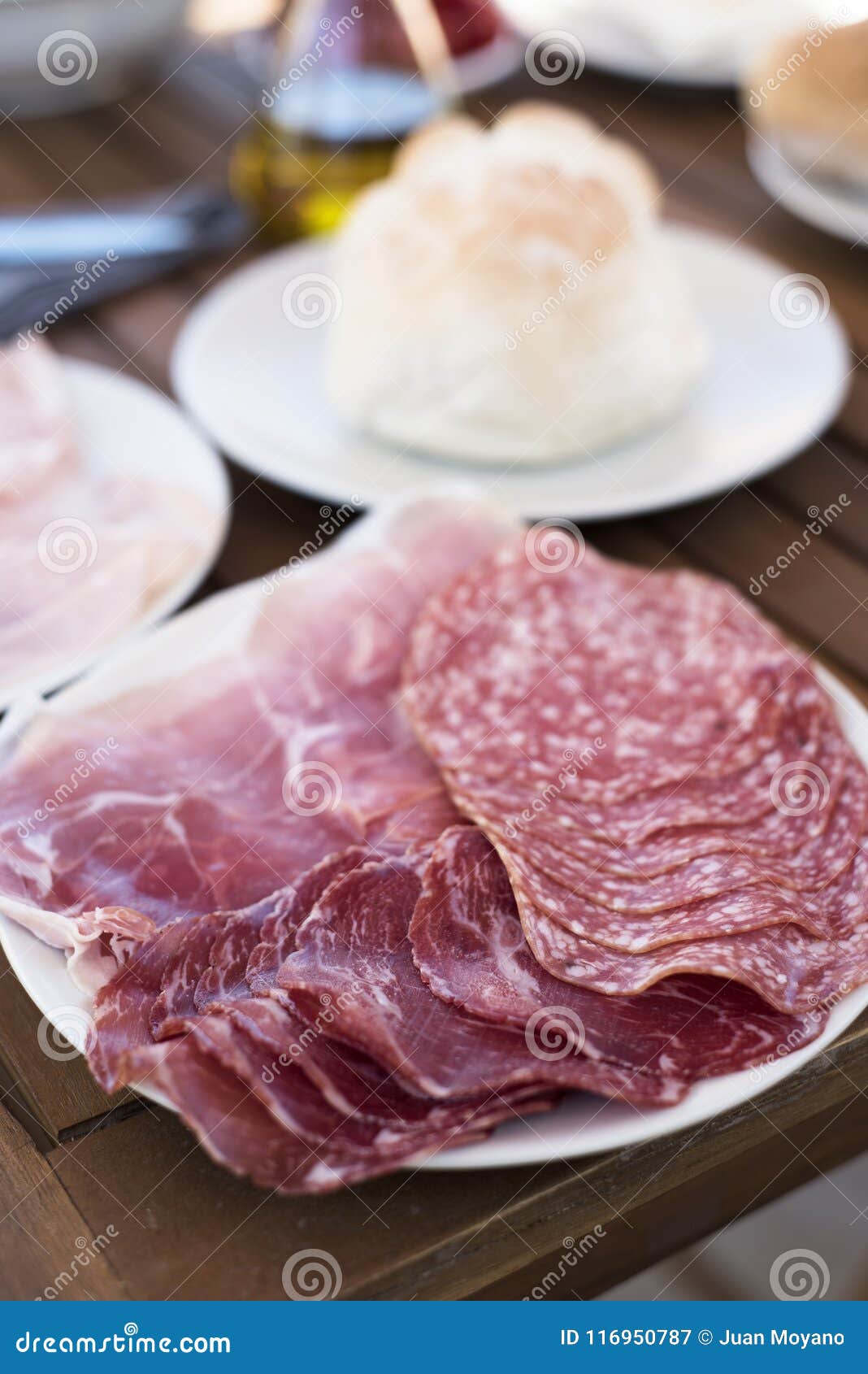 Plate with Different Cold Cuts on a Table Stock Image - Image of ...