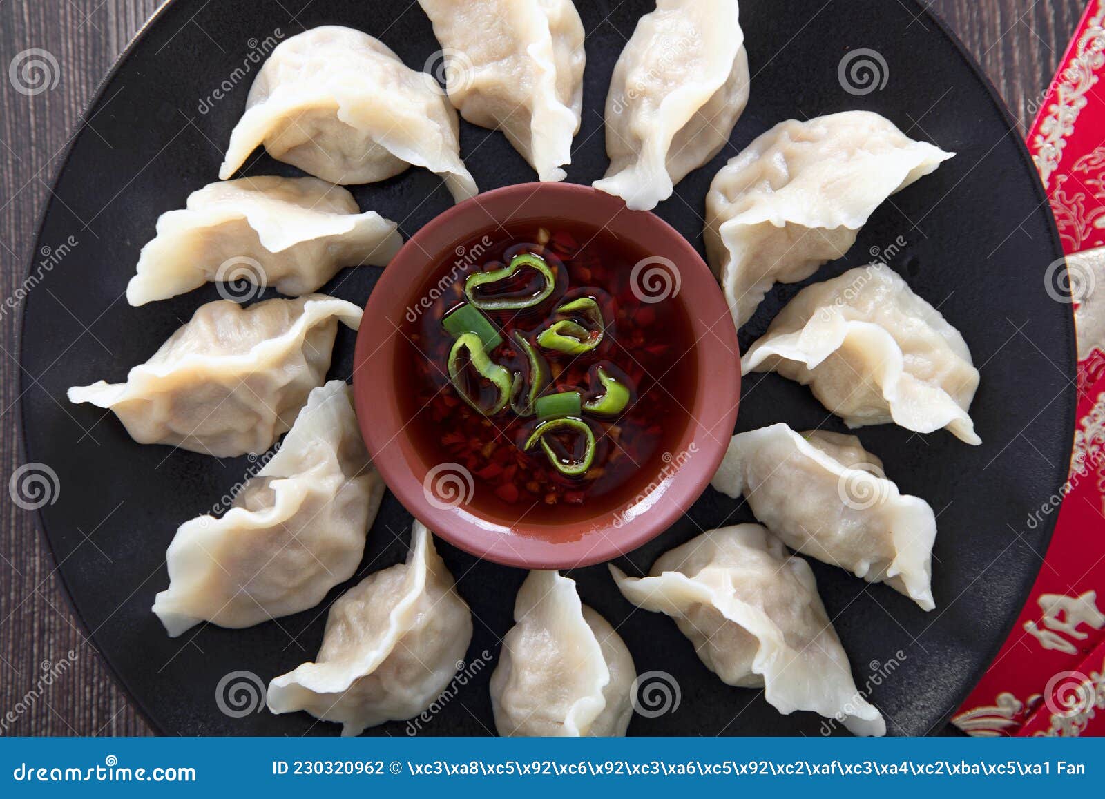 A Plate of Dumplings and Red Packets Stock Photo - Image of food, still ...