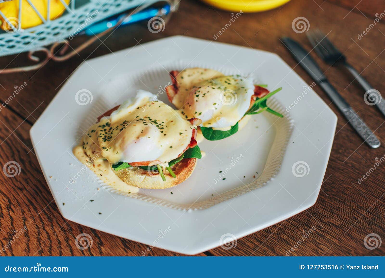 Plate of Eggs Benedict stock photo. Image of cutlery - 127253516