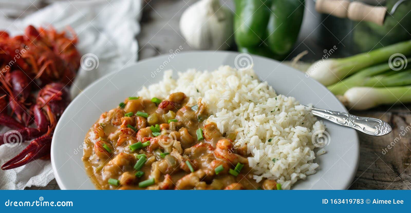Plate Filled with Crawfish Etouffee and Rice. Shown with Whole Boiled ... Plate Filled with Crawfish Etouffee and Rice. Shown with Whole Boiled ...