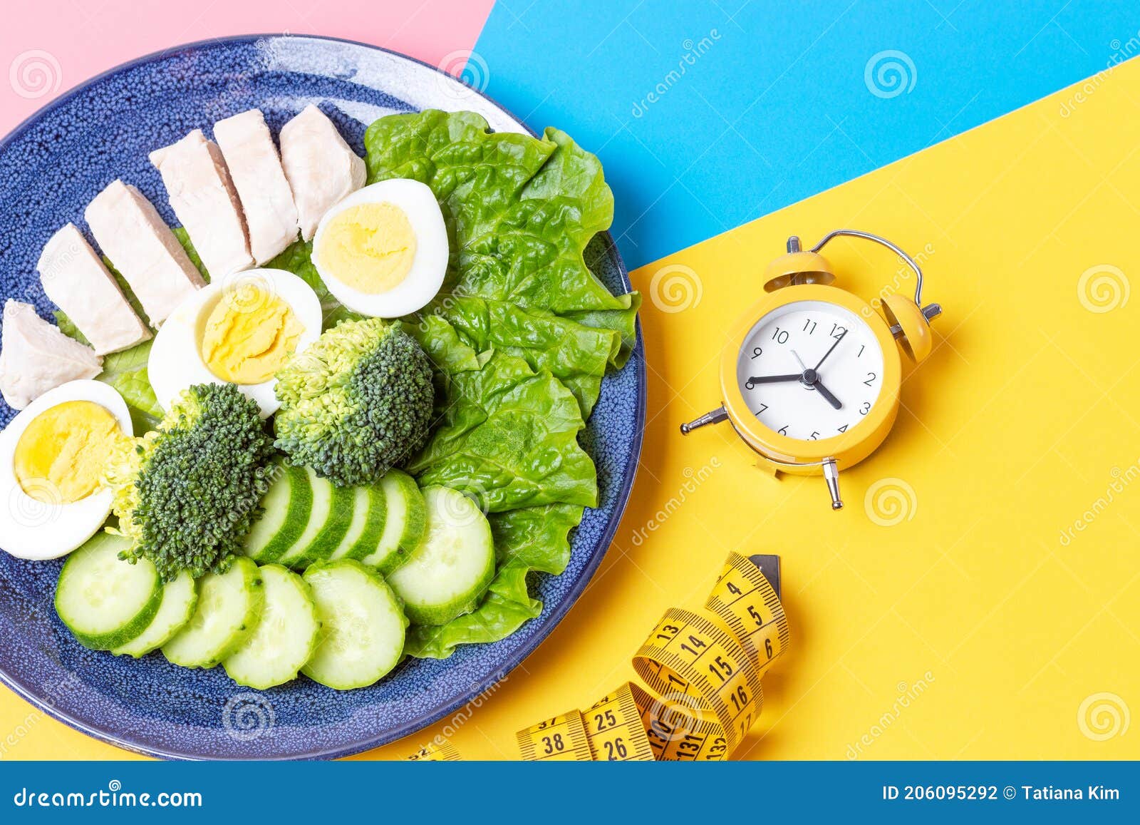 A Plate with Food on Pink and Blue Background, Interval Fasting Concept ...