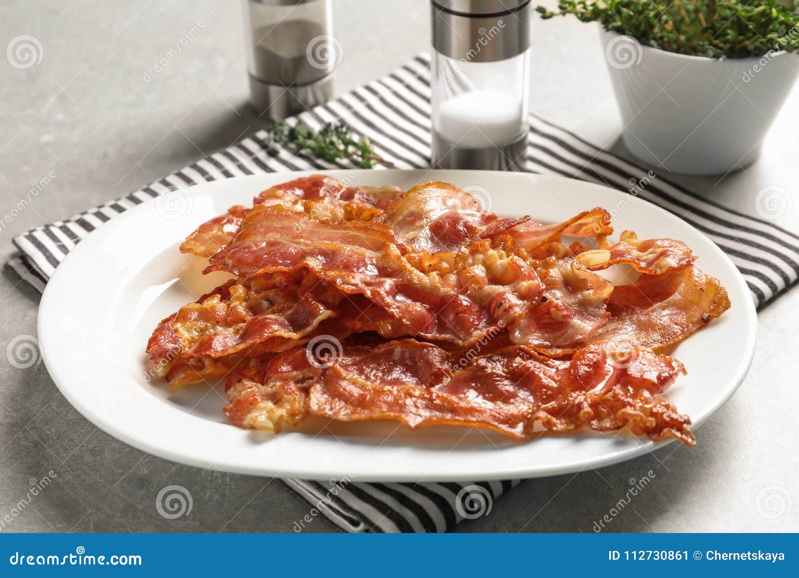Plate with fried bacon stock image. Image of crispy - 112730861