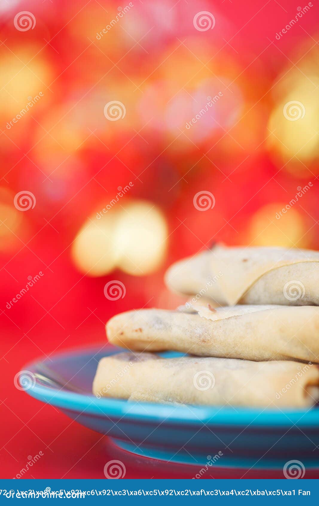 A Plate of Fried Spring Rolls on a Red Festive Background Stock Photo ...