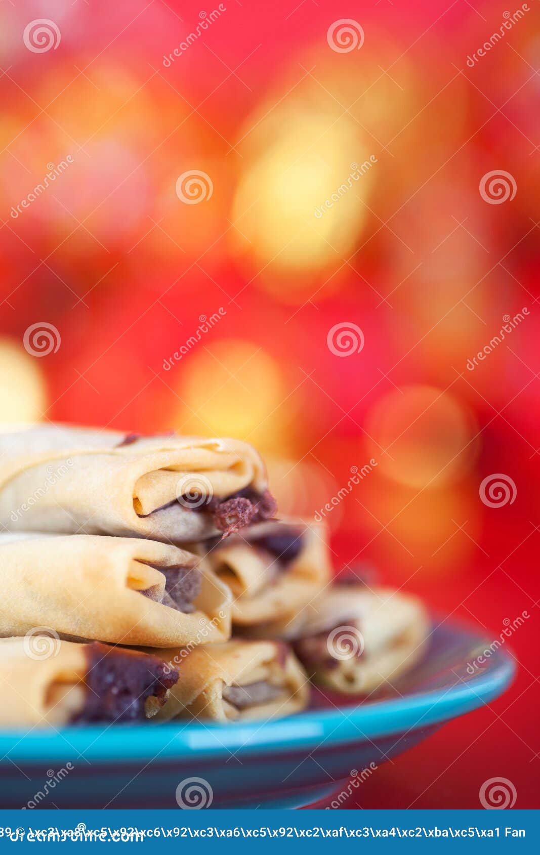 A Plate of Fried Spring Rolls on a Red Festive Background Stock Image ...