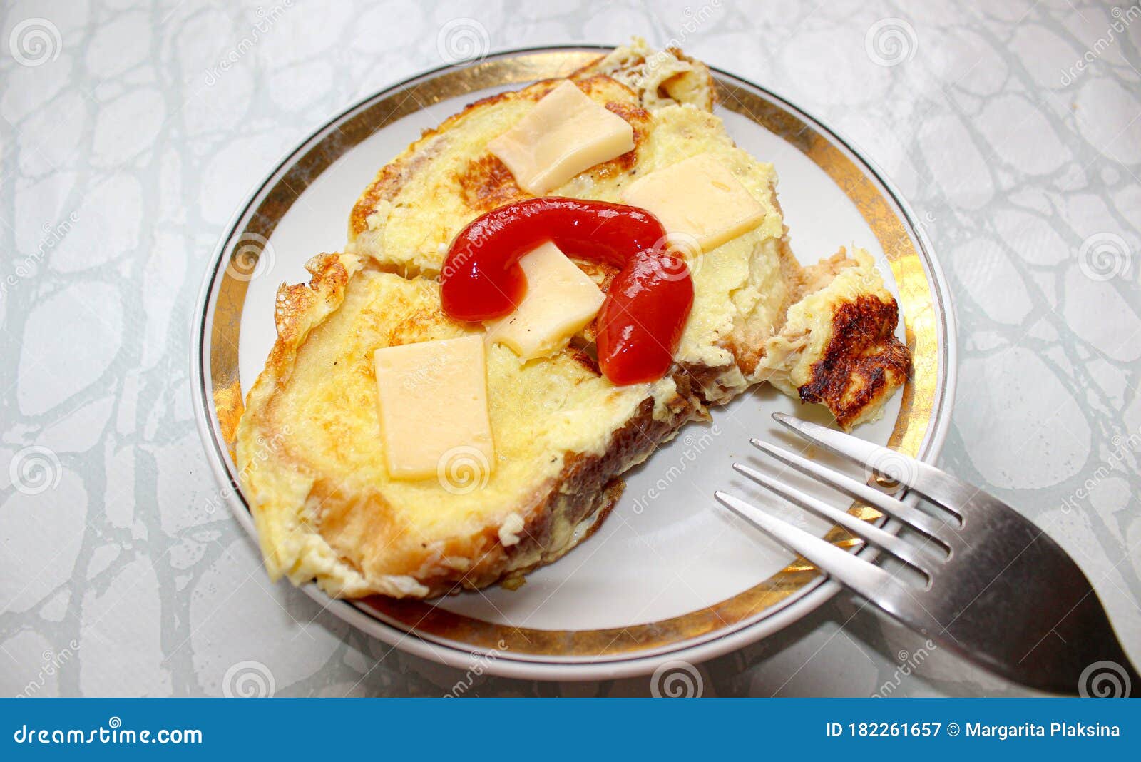On a Plate of Fried Toast with Eggs, Cheese and Ketchup Stock Image ...