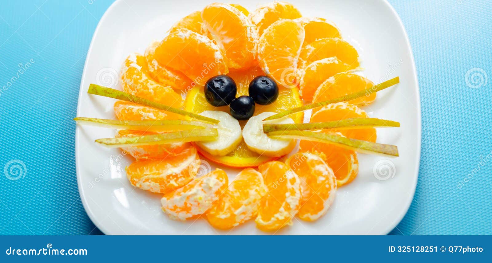A Plate of Fruit with a Face Lion Drawn on it Stock Image - Image of ...