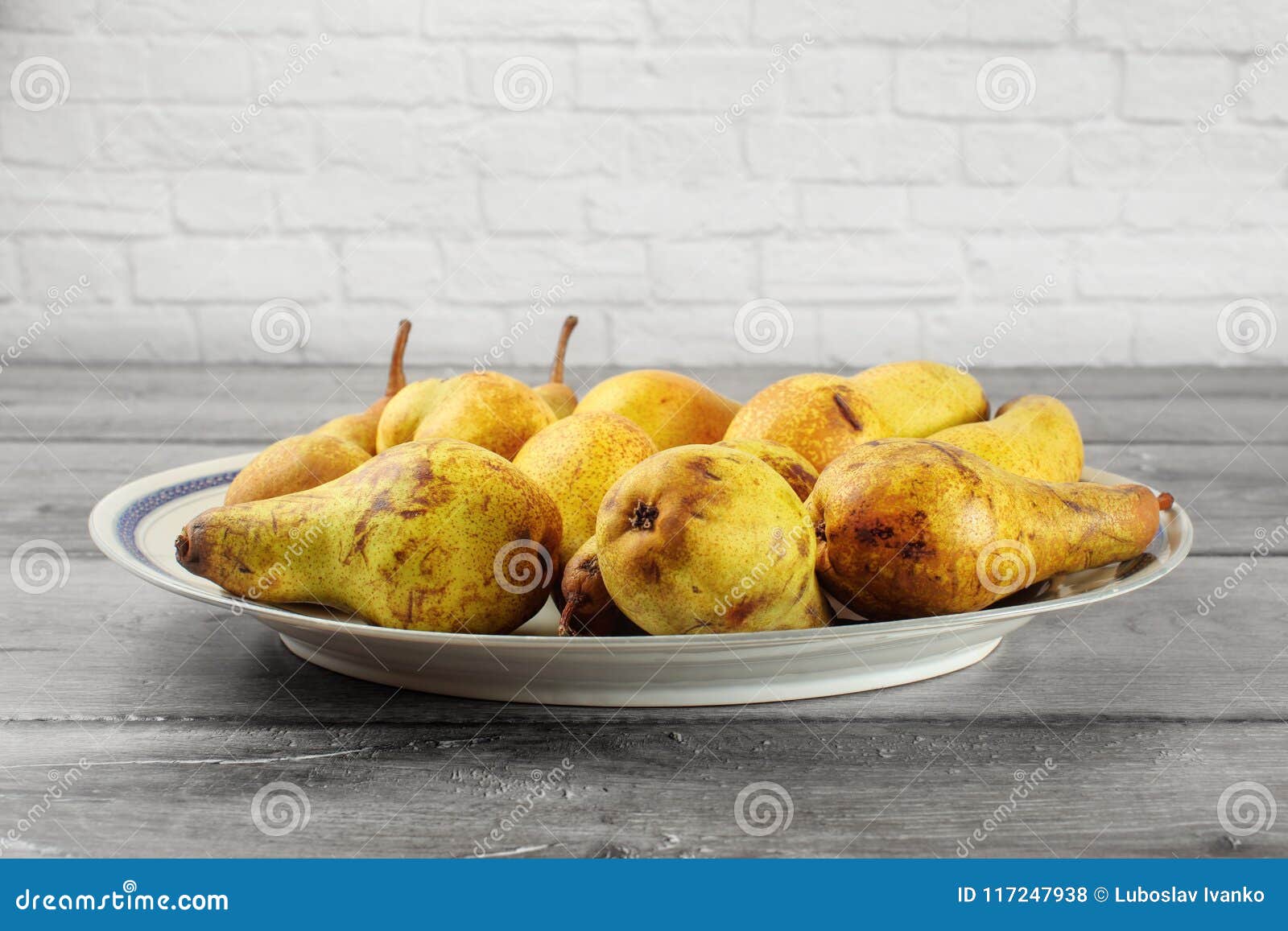Plate Full of Pears on Gray Wood Desk. Stock Photo - Image of diet ...