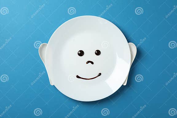 Plate with Funny Face on Blue Background Stock Image - Image of decor ...