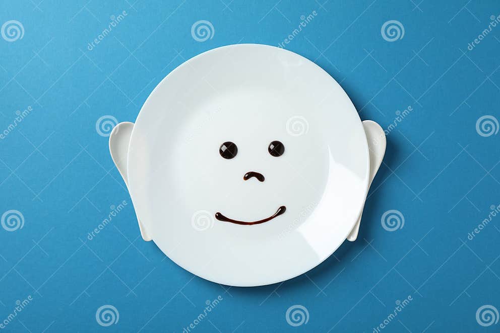 Plate with Funny Face on Blue Background Stock Image - Image of decor ...