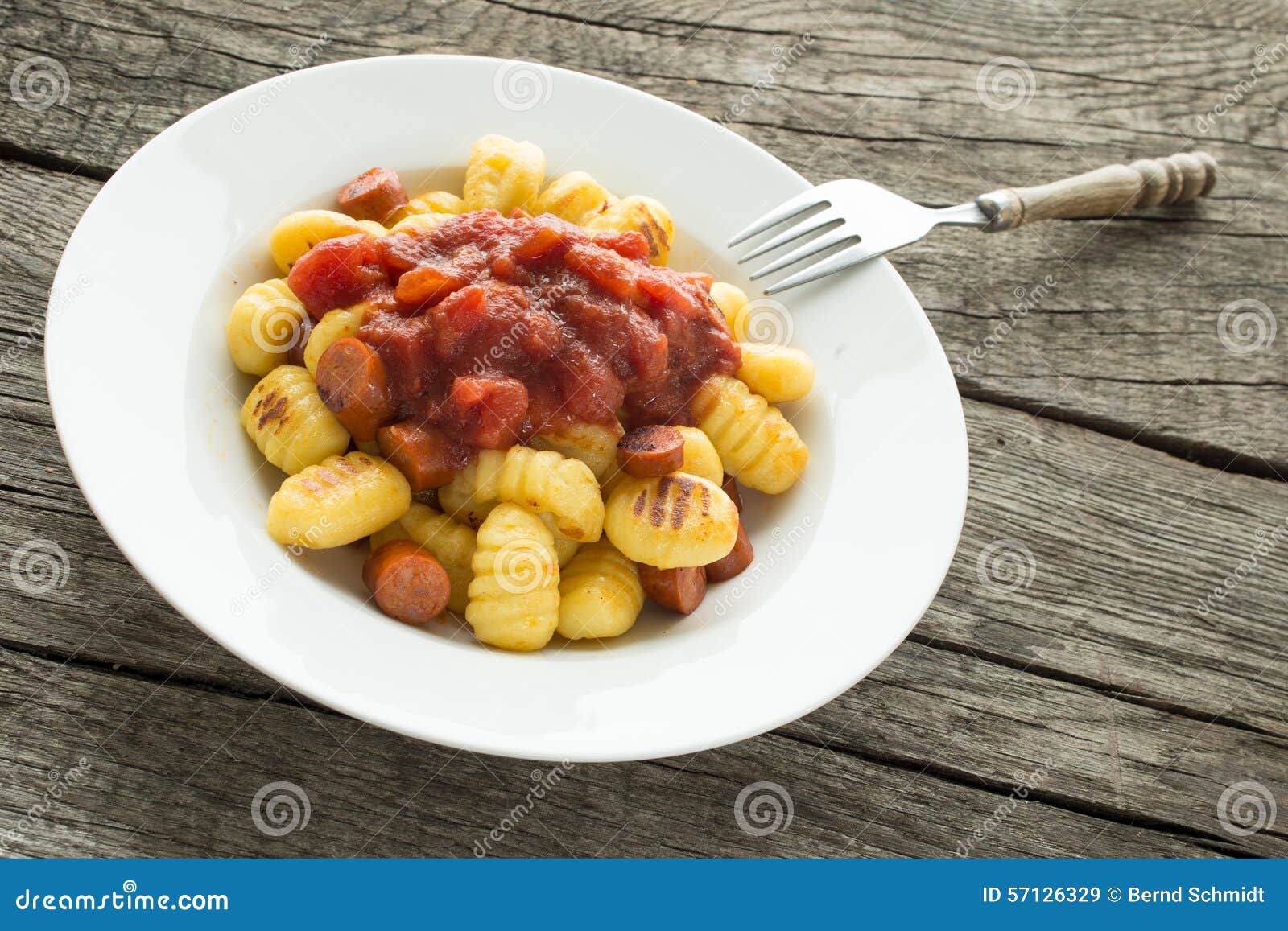 Plate of Gnocchi with fork stock image. Image of roasted - 57126329