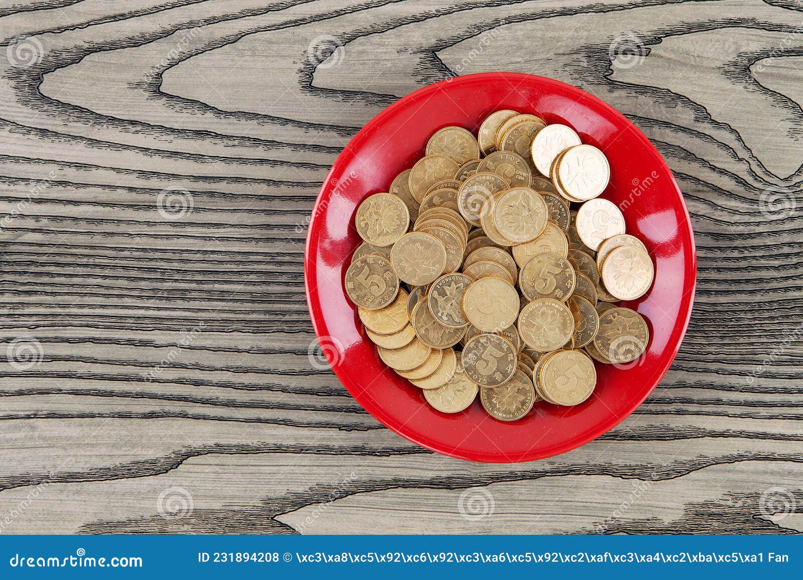 A plate of gold coins stock photo. Image of highlight - 231894208