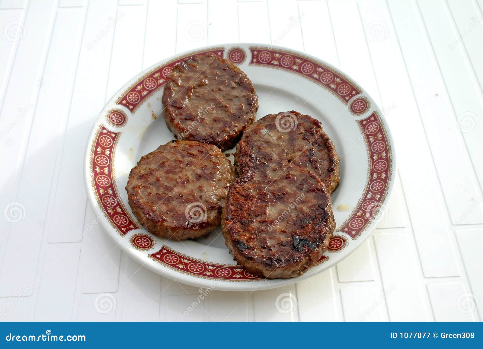 Plate of grilled burgers stock image. Image of ingredient - 1077077