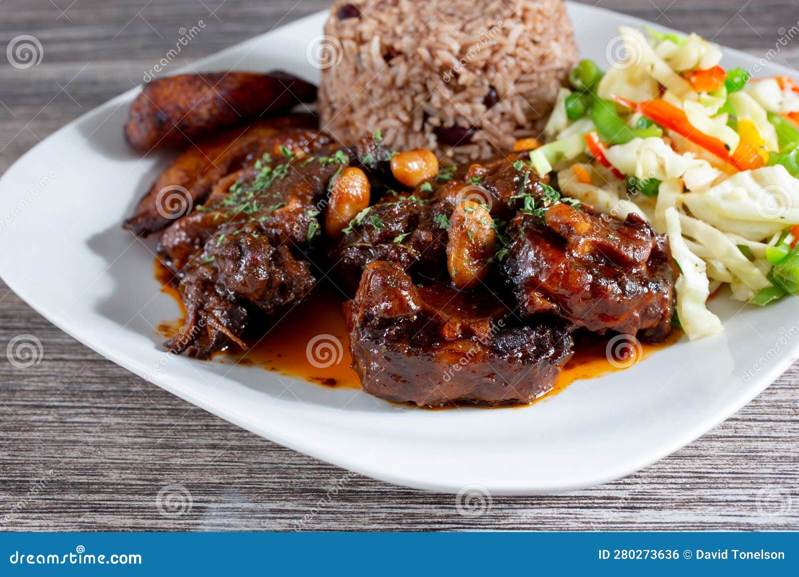 Plate of Jamaican Braised Oxtail Stock Photo - Image of fried, entree ...